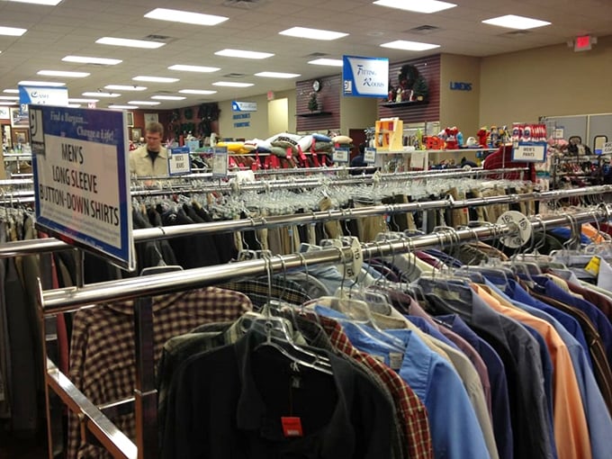 The men's department stretches into the distance like a sea of potential. Button-downs and casual wear await their chance at a second life.