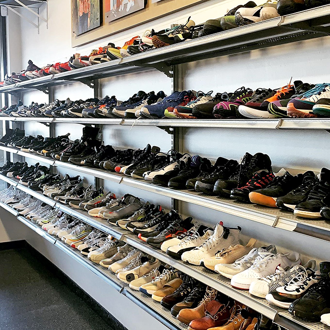 The men's footwear wall: where sneakerheads come to hunt for unicorns and dads find sensible options that won't break the bank. 