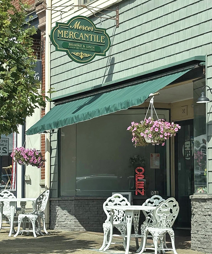 Mercer Mercantile's hanging flower baskets and sidewalk seating invite you to linger over breakfast like retirement is everybody's job.