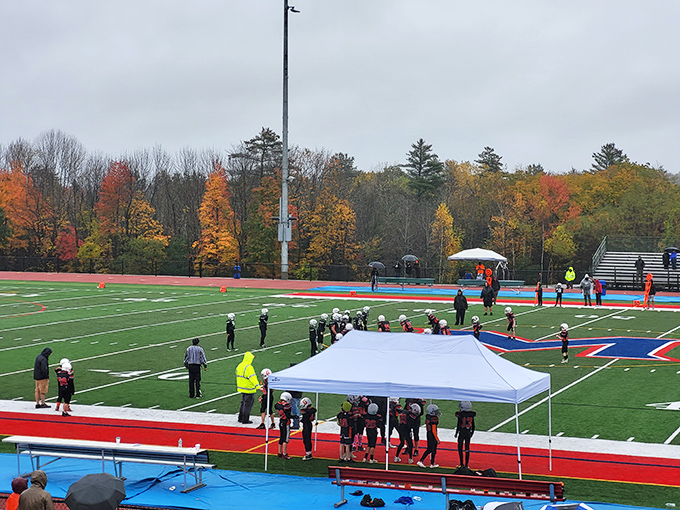 Fall football in Maine: where the foliage in the background is competing with the action on the field for your attention.