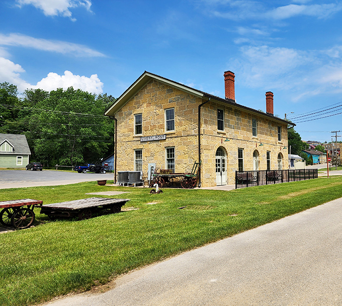 The old Railroad Depot now houses memories instead of passengers, its sturdy limestone walls a testament to permanent craftsmanship.