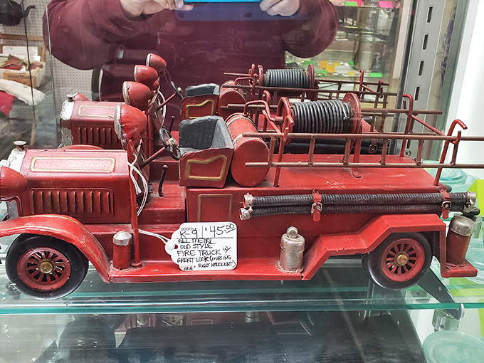 This vintage fire truck has rescued countless childhoods since the 1950s, its ladder still ready for imaginary emergencies seven decades later.
