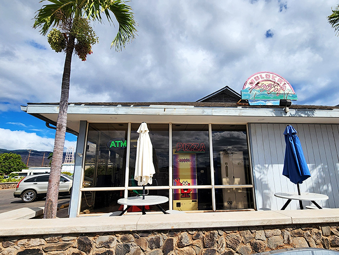 Molokai Pizza's unassuming exterior hides delicious island-style pies. No fancy frills, just good food with a view.