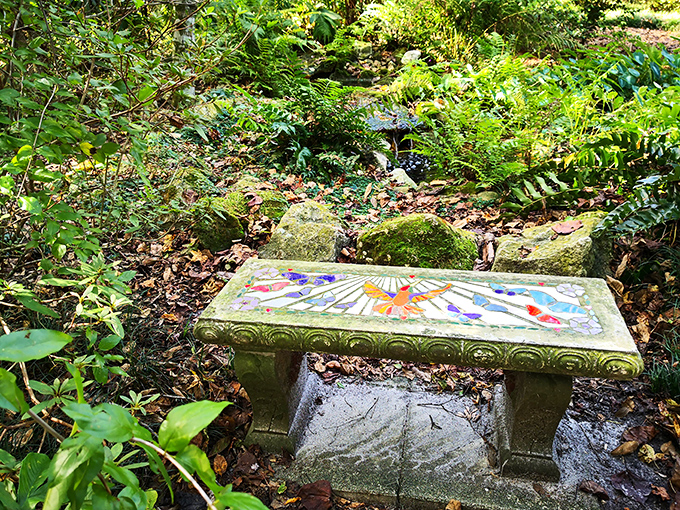 A mosaic bench offers both art and rest along the garden path. Sit awhile&mdash;the butterflies and birds are putting on a show.