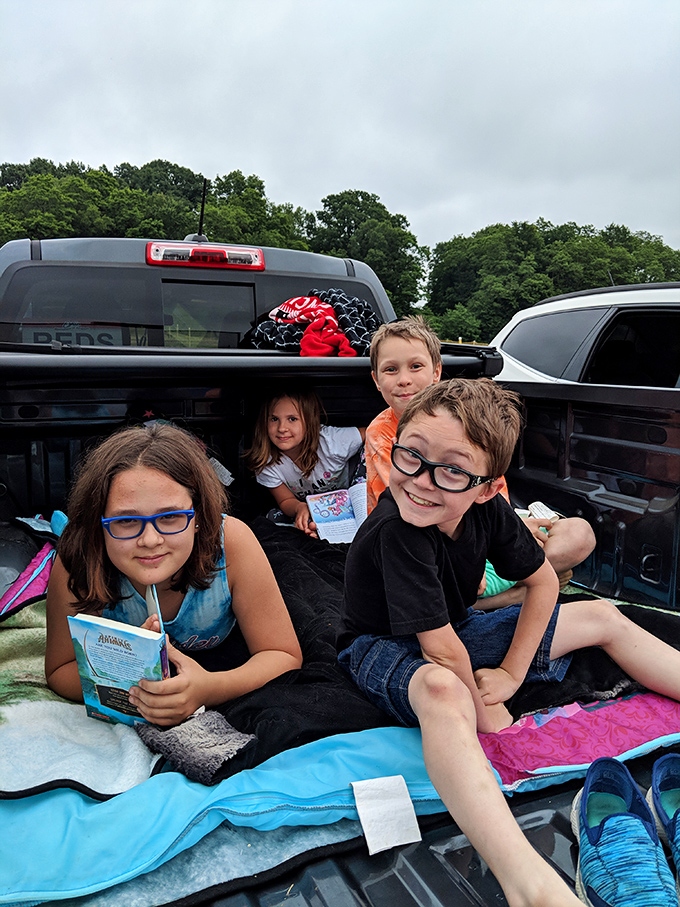 The pickup truck bed: nature's perfect theater seating since long before stadium recliners were a thing.