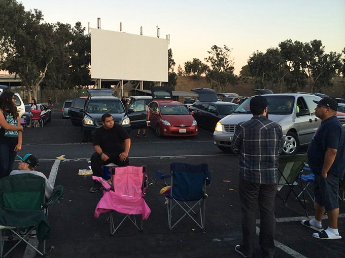 The true spirit of drive-in culture: folding chairs, friendly conversation, and the freedom to experience cinema without whispering "sorry" every time you need to stretch.