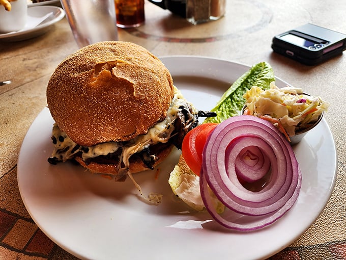 A burger that's dressed better than most people at a casual wedding&mdash;complete with the perfect supporting act of crisp lettuce and red onion.
