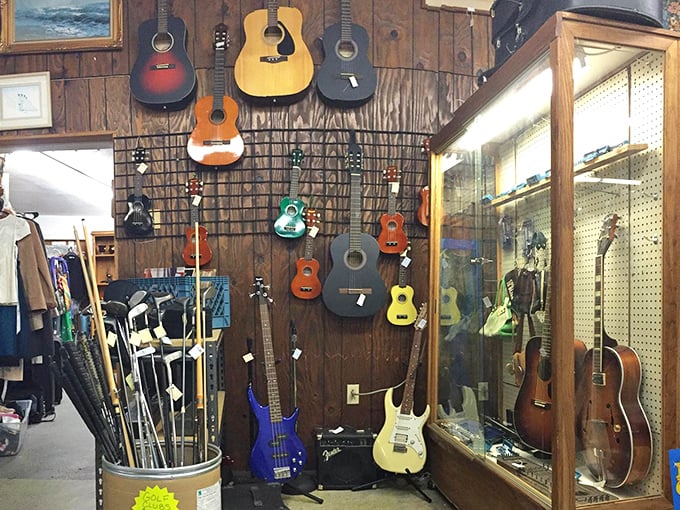 The guitar wall&mdash;where musical dreams hang in suspended animation. Someone's abandoned rock star aspirations could become your new weekend hobby.
