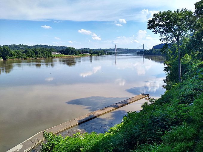 Mirror-like waters reflect both clouds and retirement dreams. The Ohio River offers waterfront views that elsewhere would add several zeros to your mortgage.