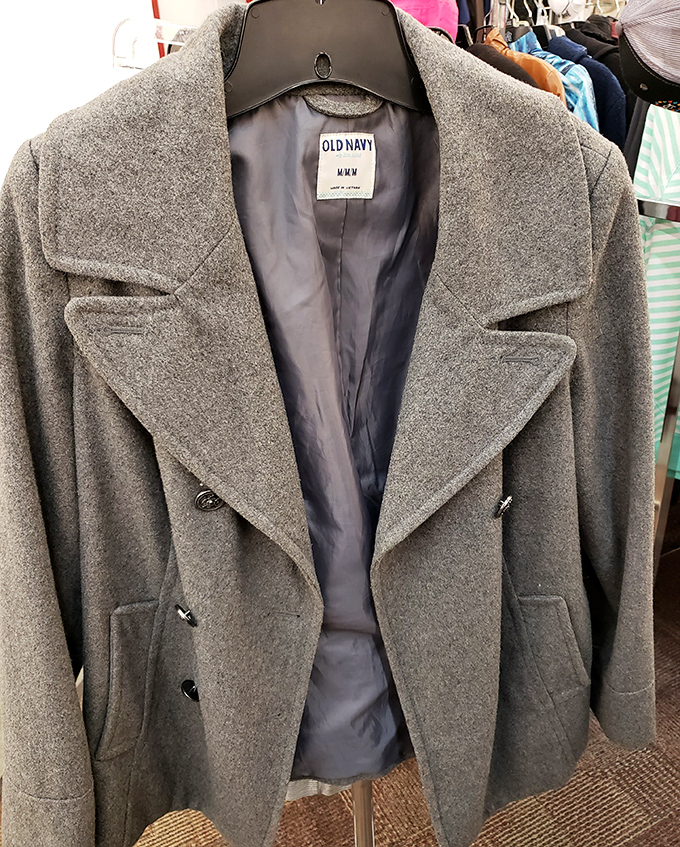 An Old Navy wool coat hangs with quiet dignity, knowing it's about to become the smartest fashion decision in someone's winter wardrobe.