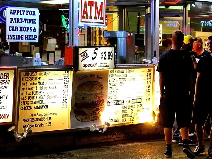 Night falls but hunger rises at this illuminated order window. The No. 5 Special beckons like a beacon in the darkness.