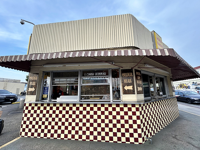 The checkered pattern says classic diner, but the line of hungry customers says legendary destination worth finding.
