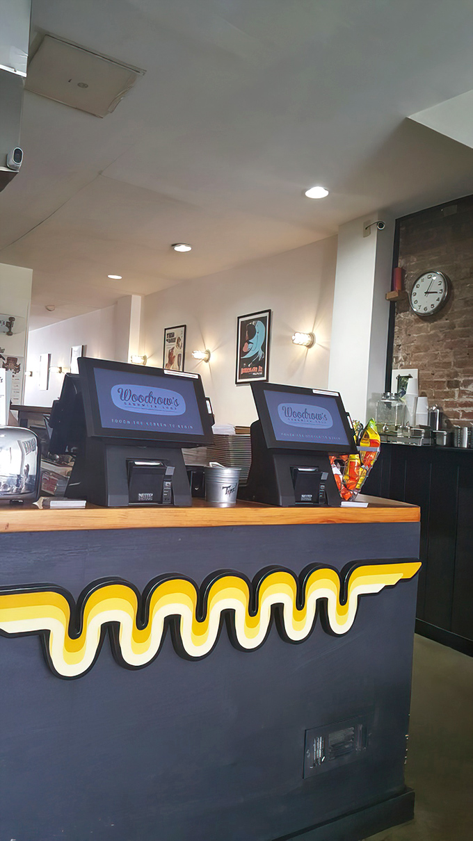 The ordering counter with its signature wavy yellow design element&mdash;where sandwich dreams begin their journey to delicious reality.