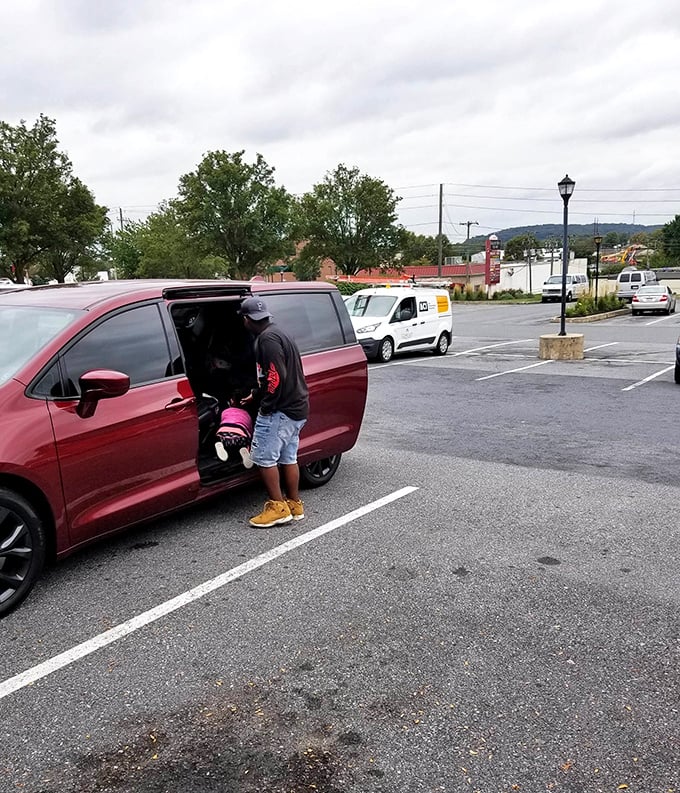 Even on rainy days, dedicated shoppers load their finds into waiting vehicles with triumphant smiles.