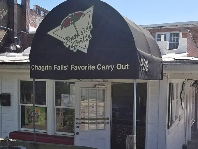 Parkside Grille's unassuming exterior hides what locals know: some of the best carry-out comfort food in town awaits behind that simple door.