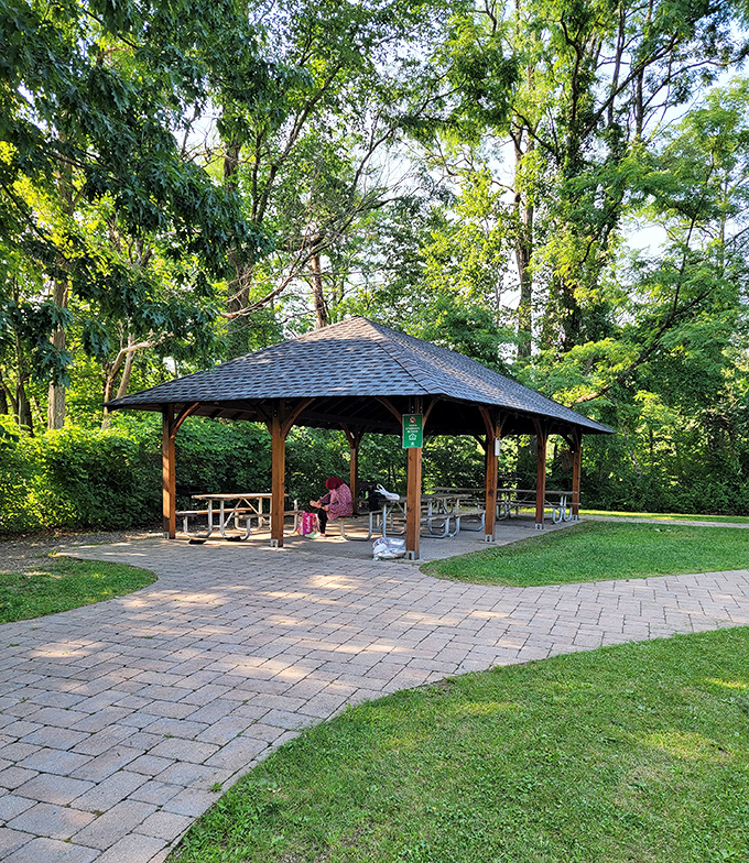 Picnic paradise found! This shaded pavilion offers respite from summer sun, where sandwiches somehow taste better than they do at home.
