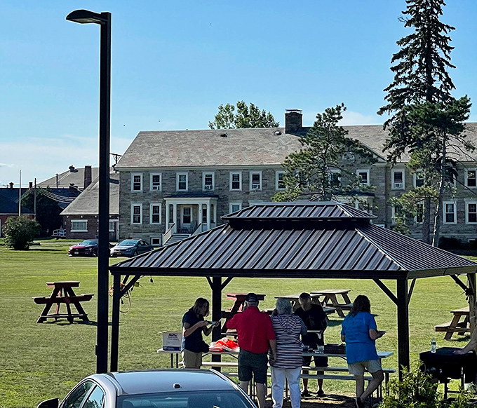 Community gatherings under the pavilion &ndash; where potlucks become feasts and strangers become neighbors. Plattsburgh's version of social networking.