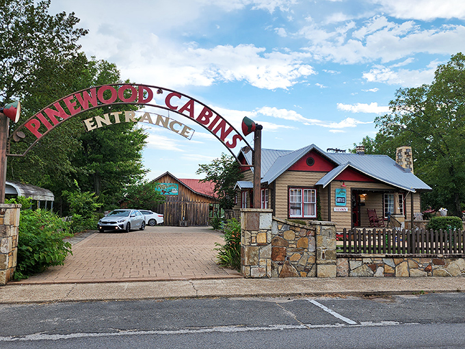 Pinewood Cabins welcomes visitors with an arch that might as well say, "Your blood pressure will drop in 3...2...1..."