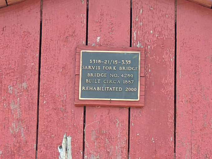 The modest plaque tells a simple story: built 1887, rehabilitated 2000&mdash;a testament to West Virginia's commitment to preserving its wooden treasures.