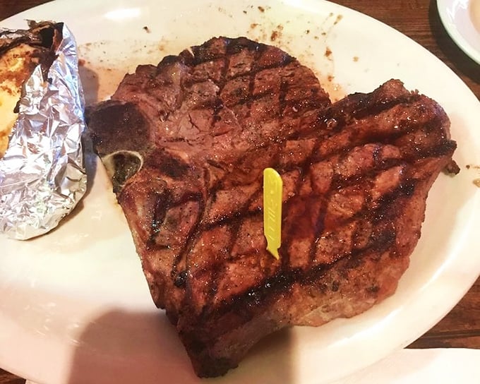 This porterhouse commands respect on the plate, wearing its grill marks like medals of honor.