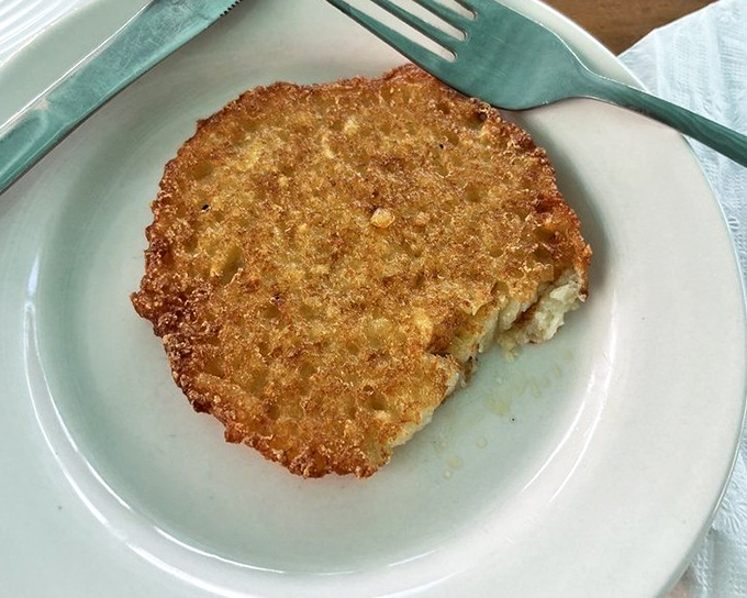 A crispy potato pancake that's golden-brown perfection on a plate, simple and satisfying in the best possible way.