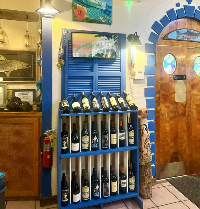 A wine selection that proves someone here understands that great seafood deserves equally thoughtful libations. That blue rack is practically a maritime beacon.