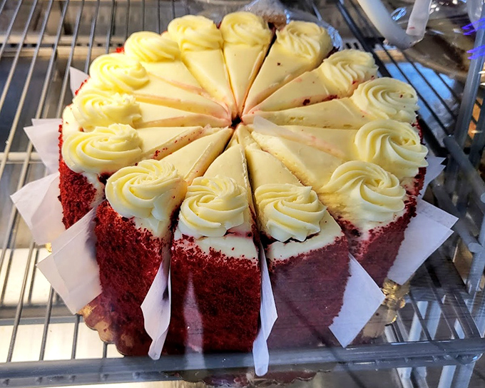 Red velvet cake sliced with mathematical precision. Each piece promises the perfect frosting-to-cake ratio &ndash; a dessert engineer's triumph.