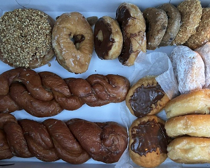 A donut box that answers life's most important question: "Why choose between powdered and glazed when you can have both?"