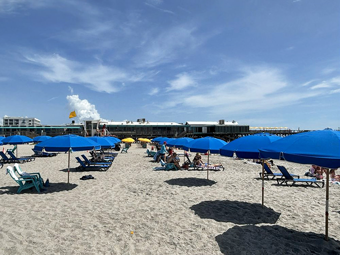 Blue umbrellas dot the sand like oversized forget-me-nots. Beach chair rentals save you from the age-old vacation dilemma: "How much can I actually carry?"