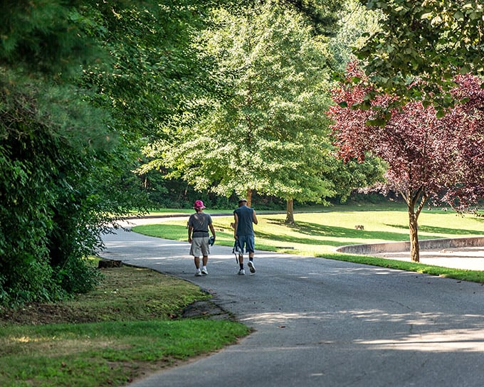 Two friends strolling Chicopee's park paths demonstrate the town's greatest luxury &ndash; time to walk side-by-side without staring at phones or rushing to the next appointment.