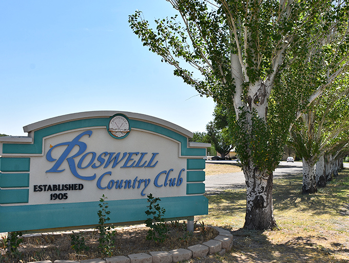 The Roswell Country Club sign hints at affordable golf memberships &ndash; where retirement dollars go further and the only "green men" are those working on their putting.