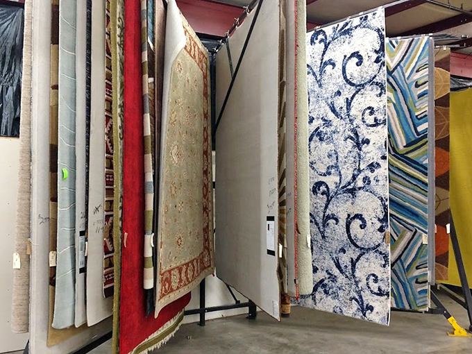 A rainbow of rugs hanging like abstract art&mdash;each pattern telling stories of different eras, regions, and design philosophies.