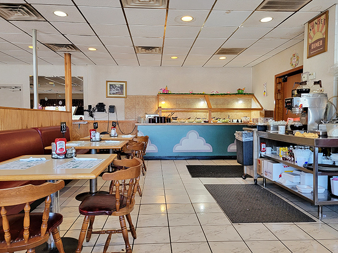 The salad bar and beverage station stand ready for action, a self-service oasis promising fresh additions to your meal.