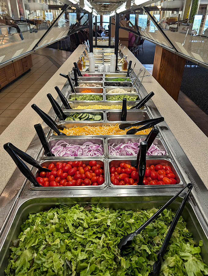 The salad bar stretches into the distance like a produce parade, colorful and surprisingly tempting for rabbit food.
