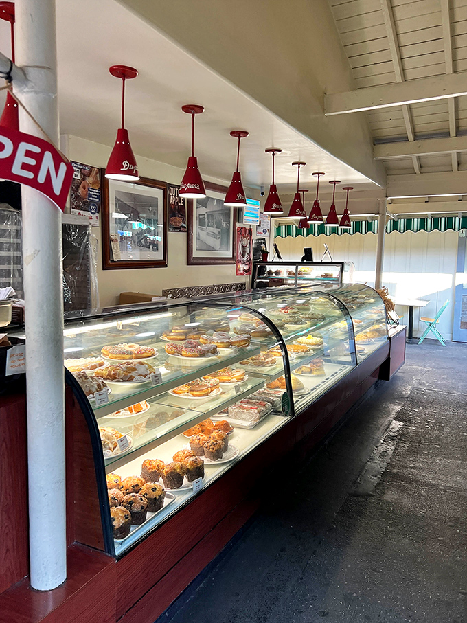 Those red pendant lights aren't just illuminating pastries&mdash;they're spotlighting the supporting characters in Du-par's delicious drama.