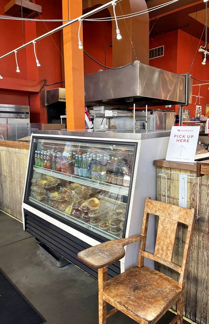 Behind the counter, where barbecue magic happens &ndash; a display case of sides and desserts that makes decision-making gloriously difficult.