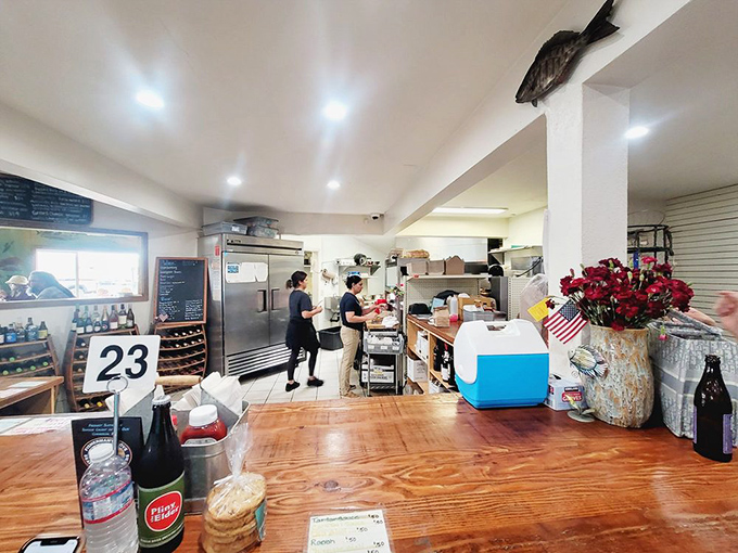 Behind the counter, culinary magic happens with minimal fuss and maximum flavor—the hallmark of truly confident cooking.