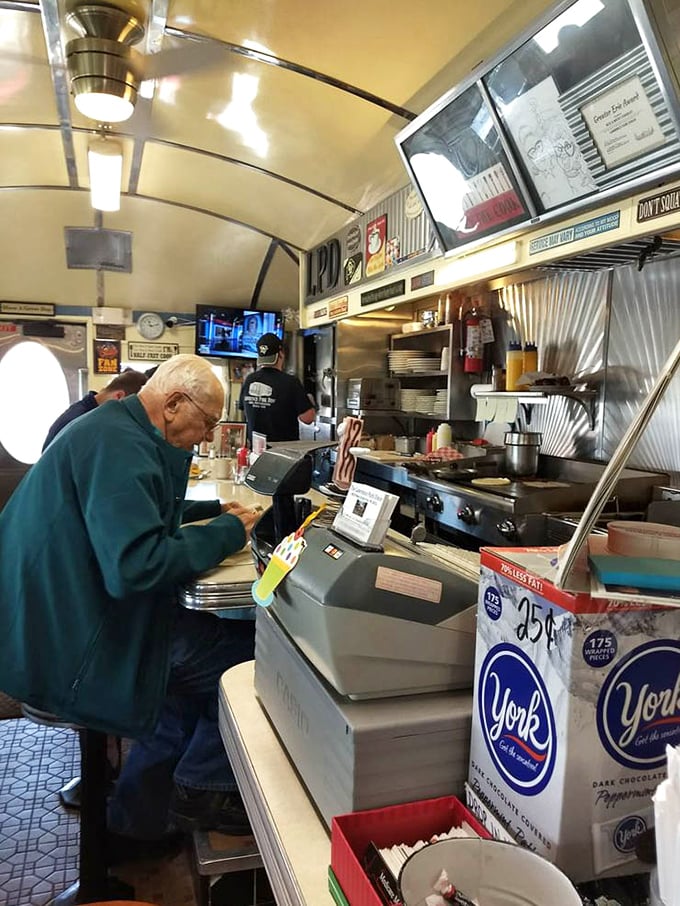 The service counter where orders get called, plates get picked up, and the breakfast magic visibly happens.