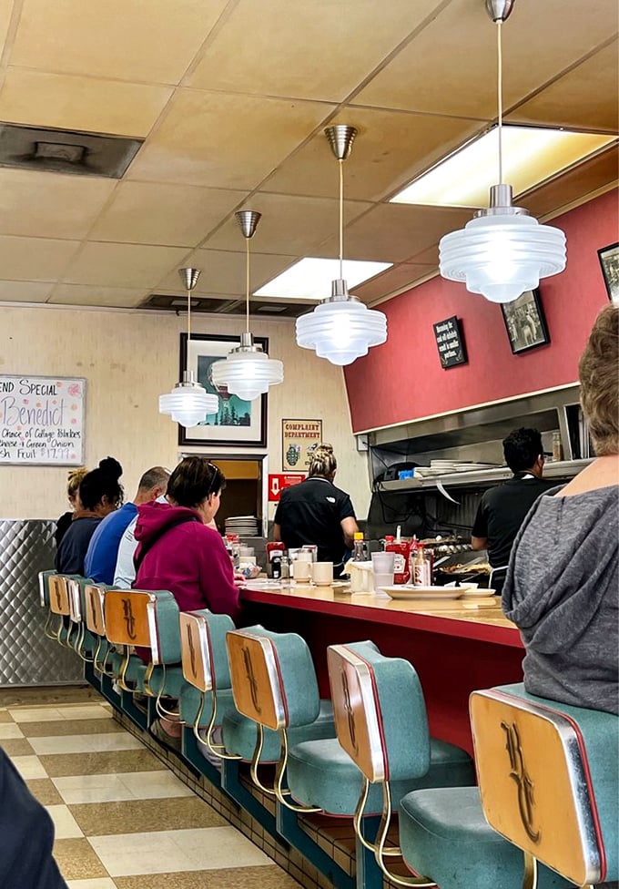 Those art deco pendant lights have witnessed decades of first dates, family gatherings, and solo diners finding comfort in a perfect breakfast.
