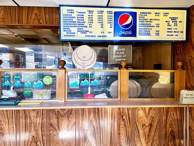 The ordering counter&mdash;where hope begins and hunger ends. Those "Best of Dayton" awards aren't just decoration; they're promises kept.