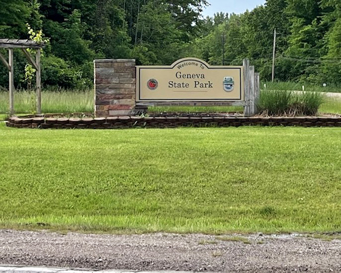 The entrance sign stands like a humble ma&icirc;tre d', giving no hint of the natural splendor waiting just beyond the reservation desk.