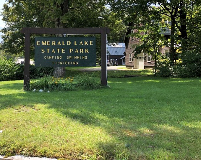The sign says it all&mdash;camping, swimming, picnicking&mdash;but fails to mention the mandatory smiling that comes with each activity.