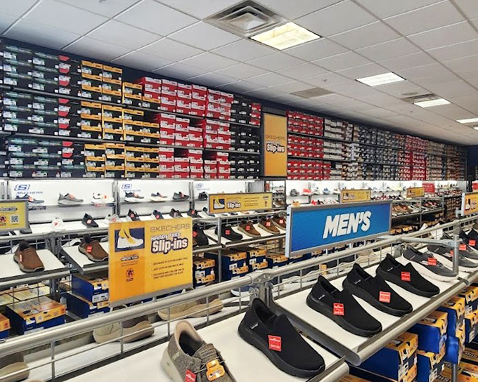 The Skechers outlet's wall of shoe boxes resembles a colorful game of Tetris, where the prize is comfortable feet at uncomfortably good prices.