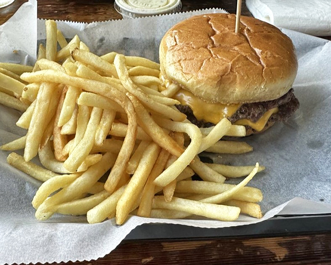 A burger that's been lovingly smashed into submission, flanked by an army of golden fries. Proof that seafood joints still respect the needs of landlubbers.