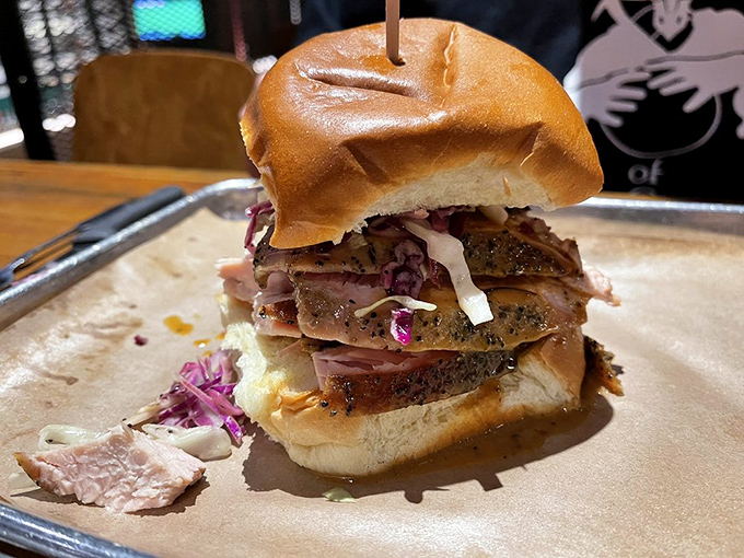 A sandwich tower that defies gravity and good manners&mdash;layers of smoked meat and vibrant slaw that demand you unhinge your jaw like a python.