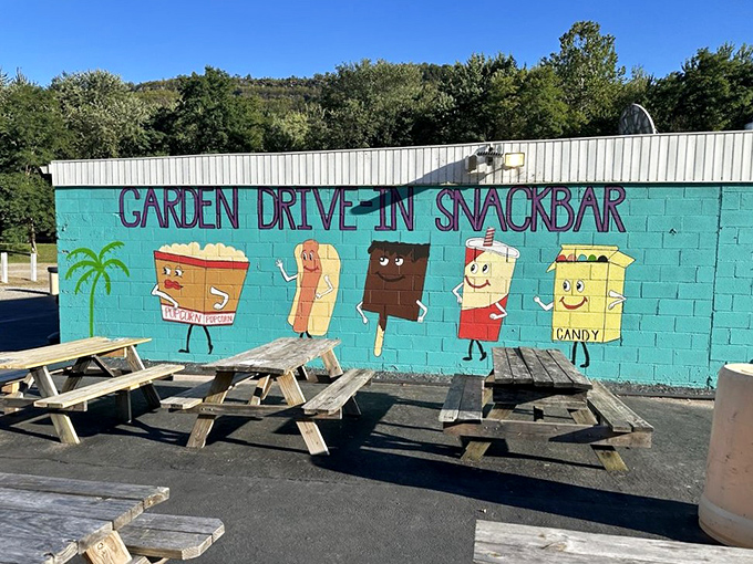 Whimsical concession characters painted with retro charm remind us that movie snacks have always been part of the show.