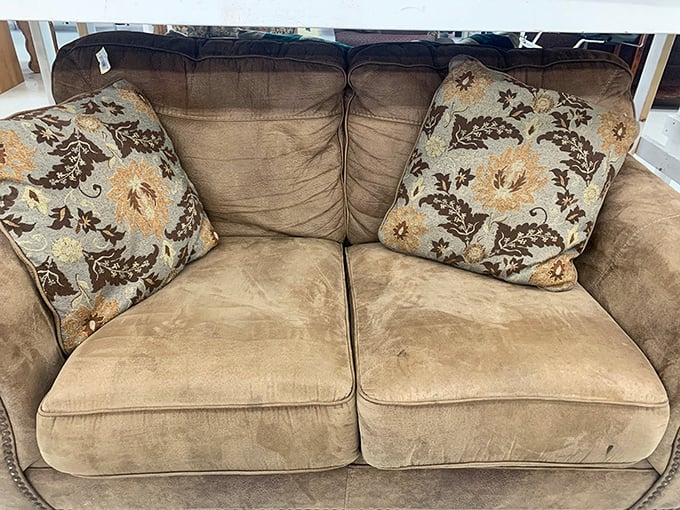 This loveseat has seen some living, but it's ready for its second act. Perfect for that corner where comfort matters more than showroom perfection.
