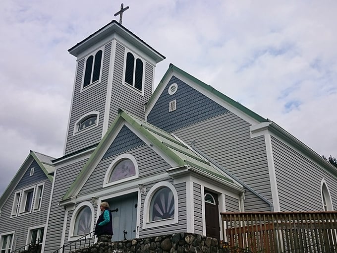 St. Rose of Lima Catholic Church reaches skyward with the same determination as the mountains behind it, faith and nature in perfect harmony.