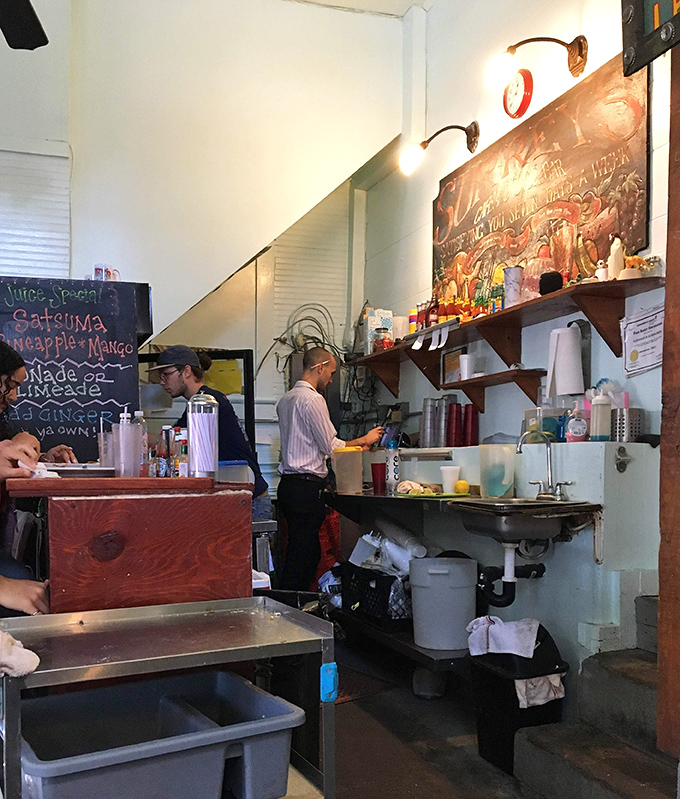 Behind the scenes at Surrey's, where the real magic happens. These aren't just staff members&mdash;they're breakfast wizards conjuring up morning miracles in a tiny kitchen.