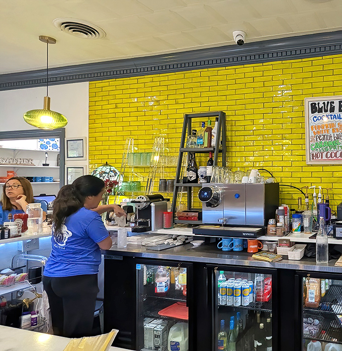 Behind that vibrant yellow tile wall, breakfast magic happens. The staff works with the precision of breakfast ballet dancers.